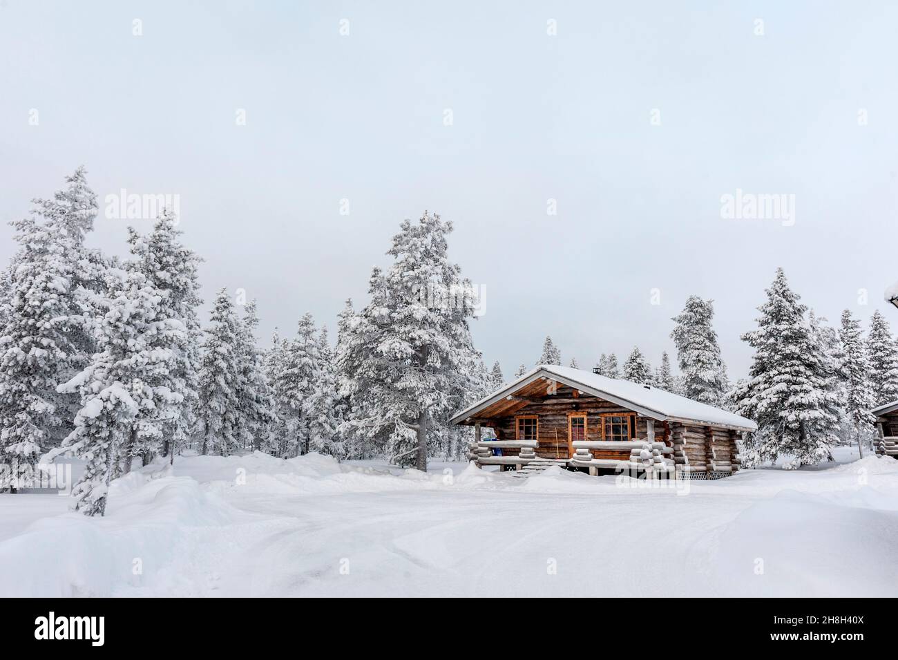 Winter wonderland Log Cabins in the frozen ice and snow Finland ...