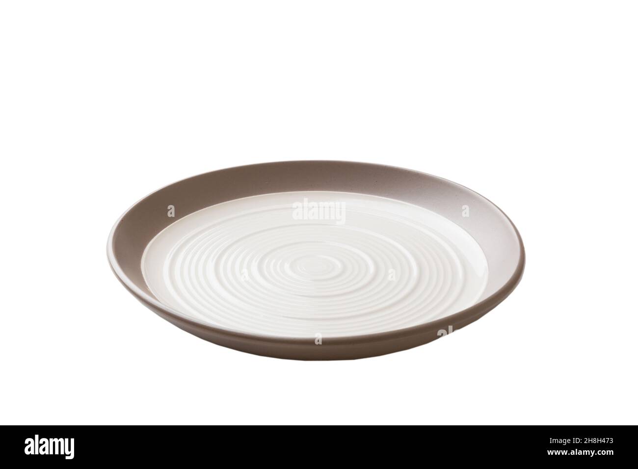 White ceramic round plate isolated over white background. perspective ...