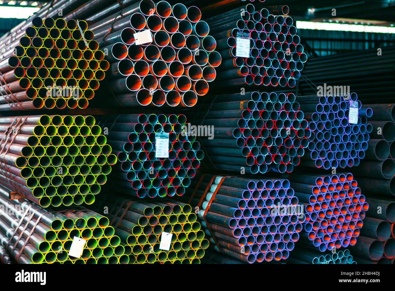 Stacked industrial pipes . Industrial warehouse Stock Photo - Alamy