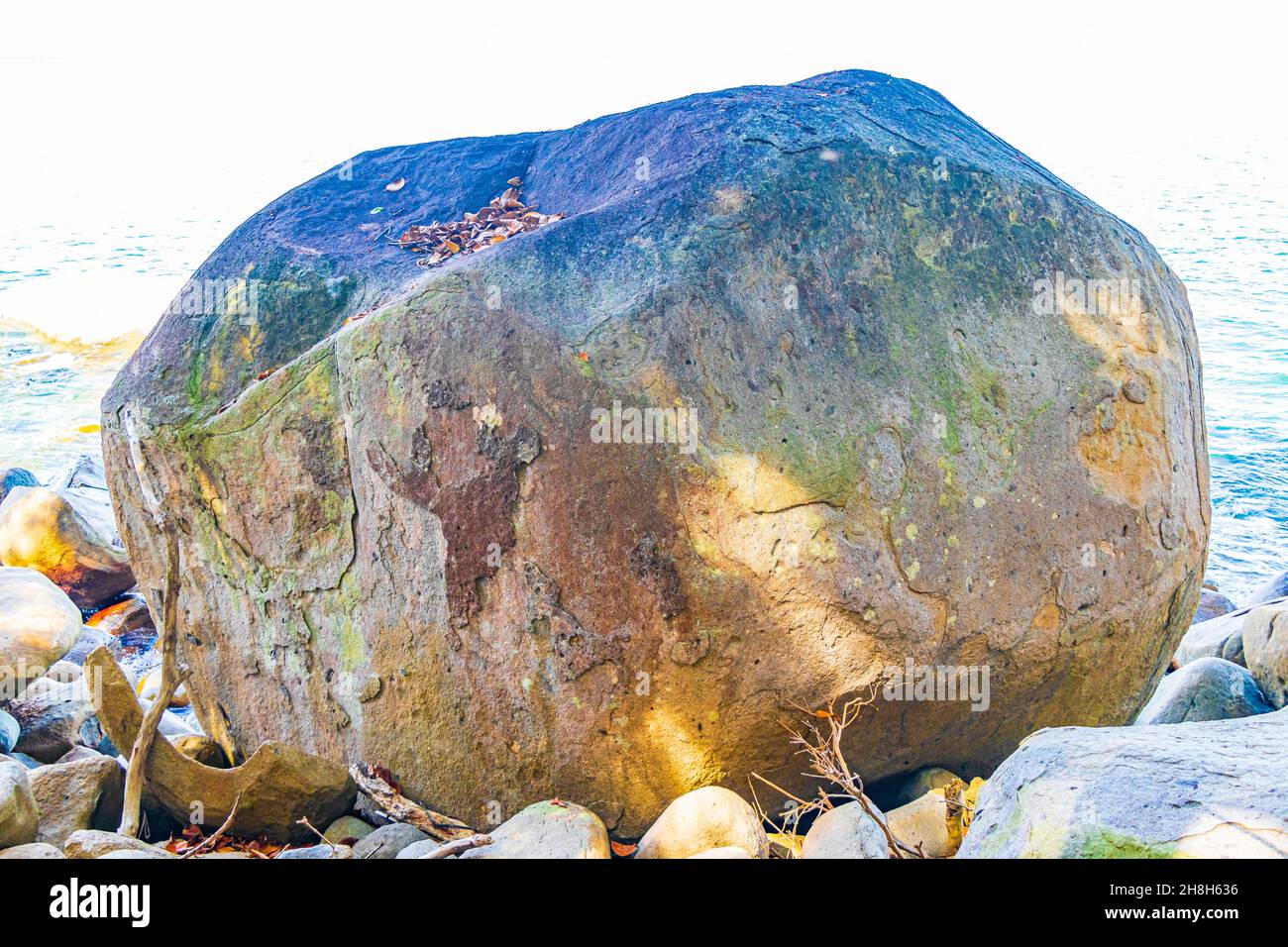 Big huge boulder rock stone in the beautiful amazing coast line and ...