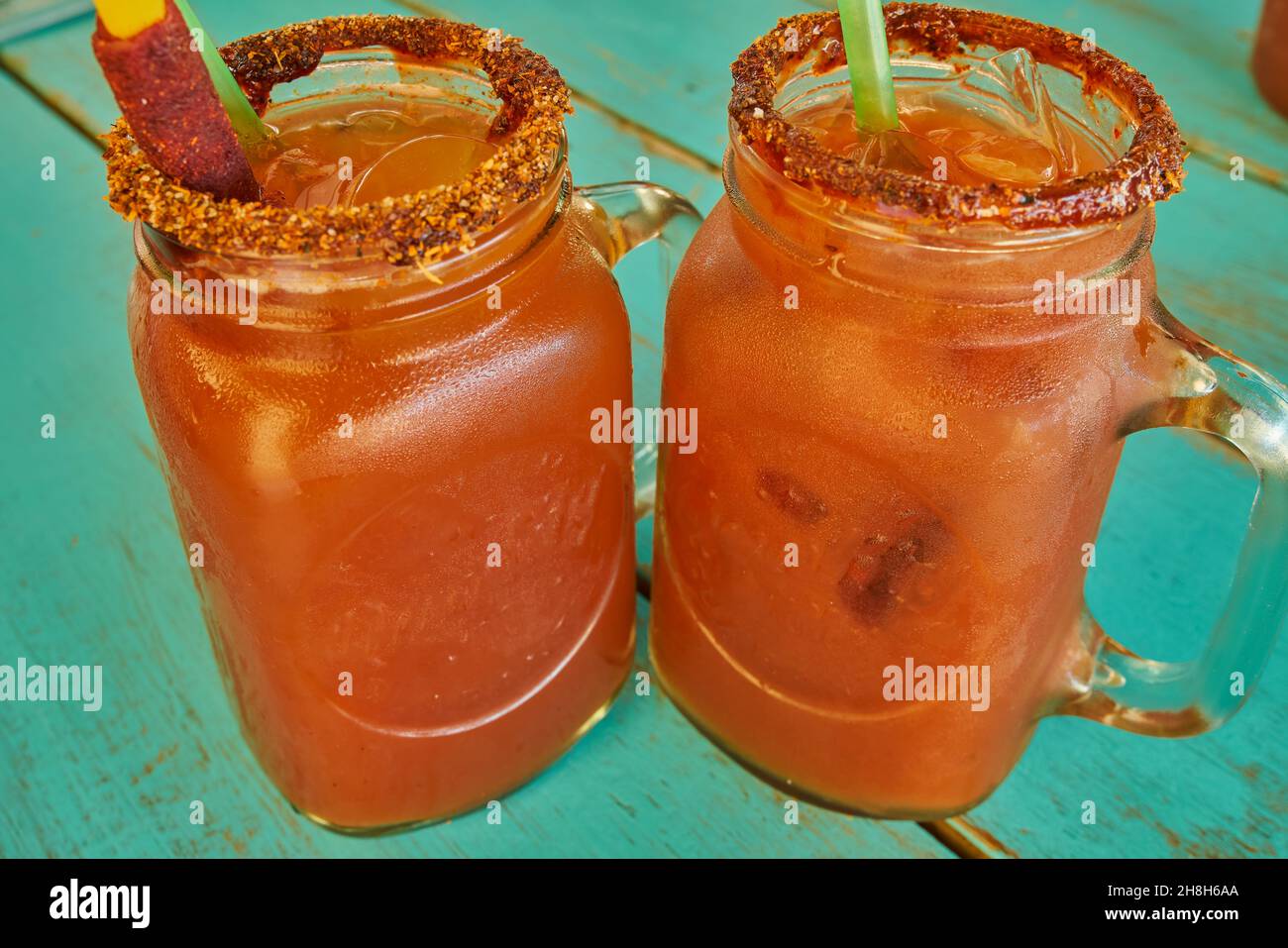 Michelada served in mason glass with tamarind candy garnish Stock Photo ...