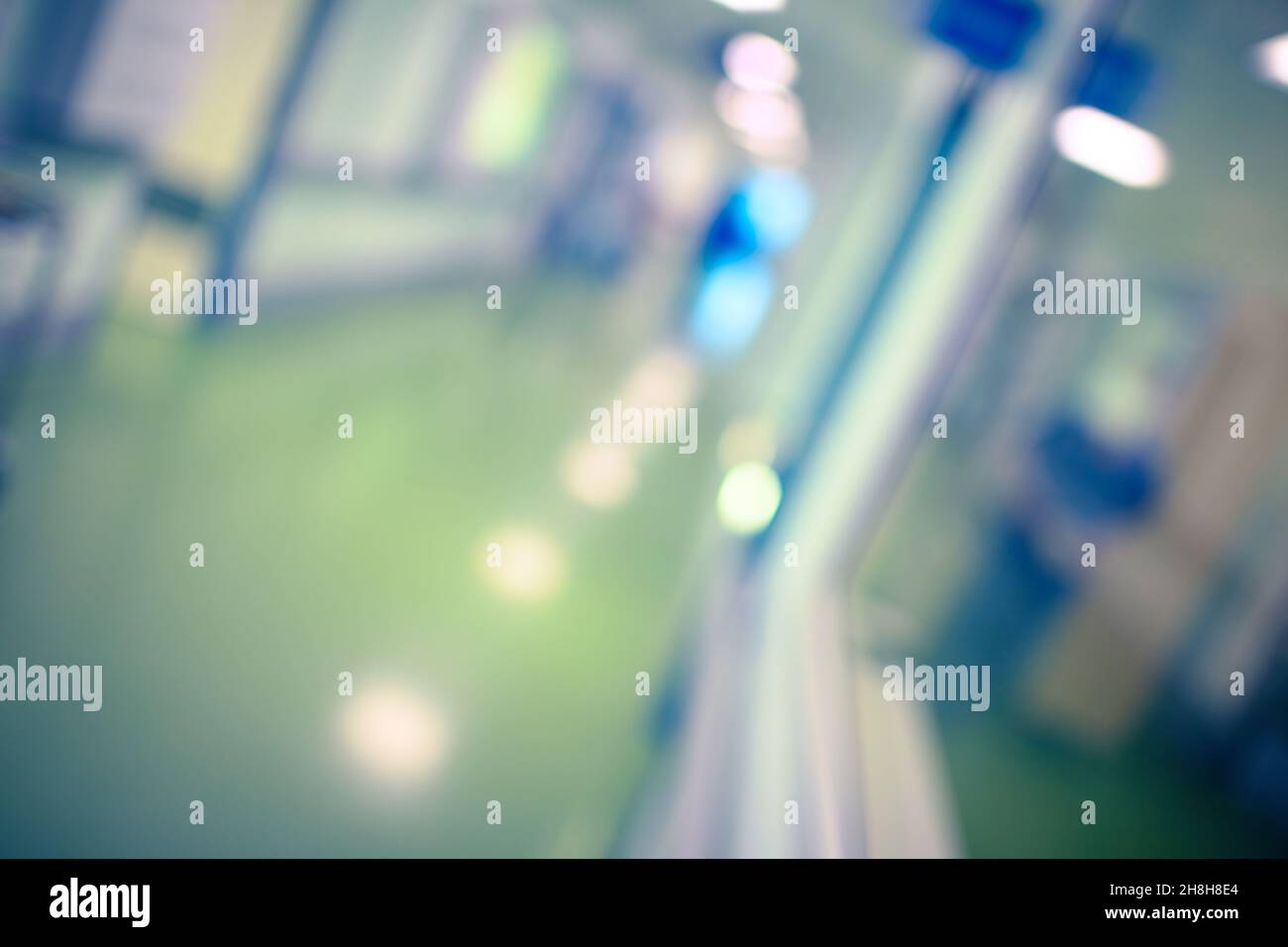 Long blurred hallway lit by ceiling lamps, unfocused background Stock ...
