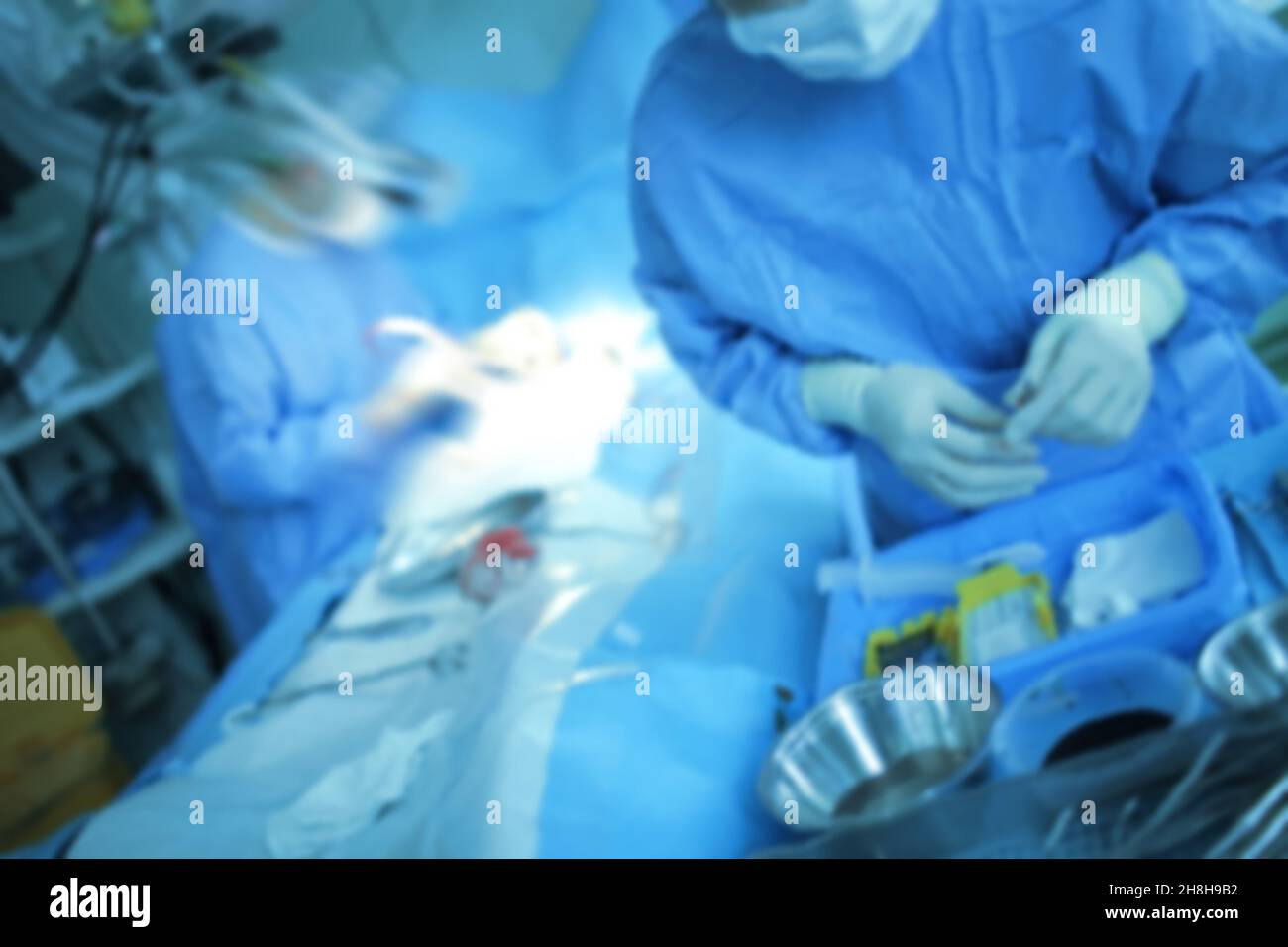 Surgeon with assistant nurse performs the emergency surgical procedure ...