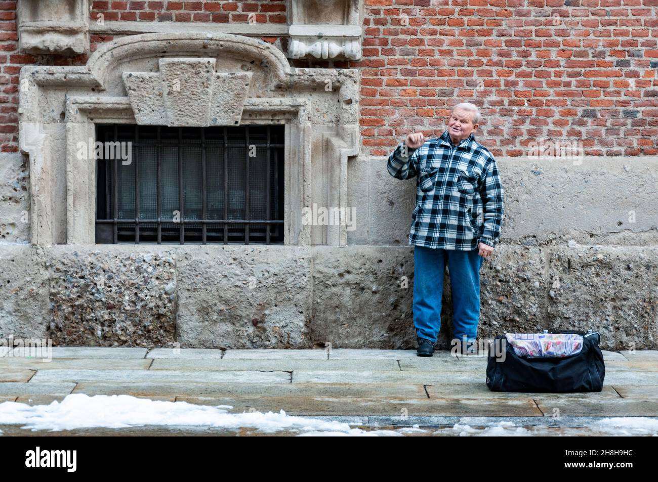 a street singer performs outside of the art gallery in Milan, Italy ...