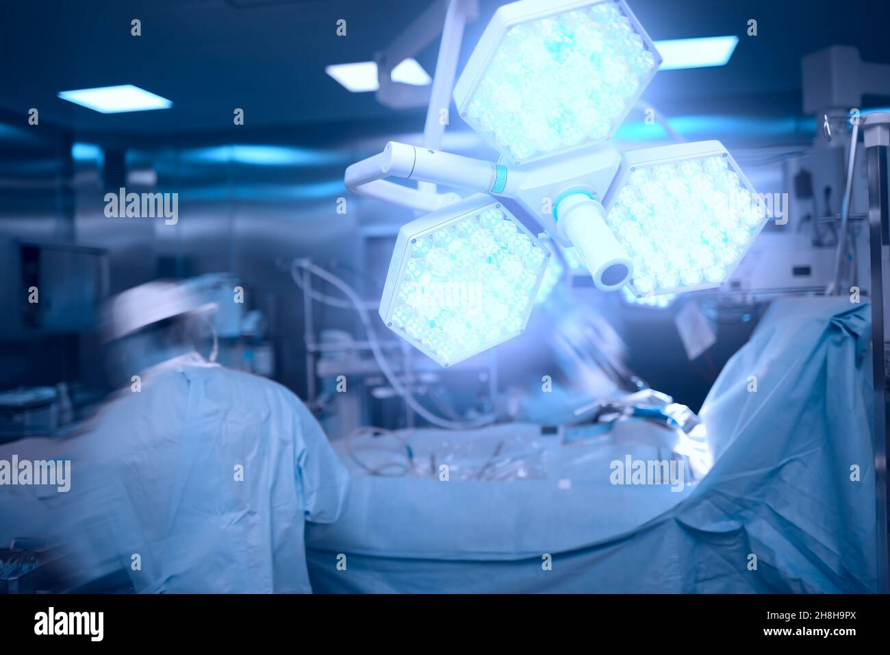 Busy surgeon in the operating room of modern hospital Stock Photo - Alamy