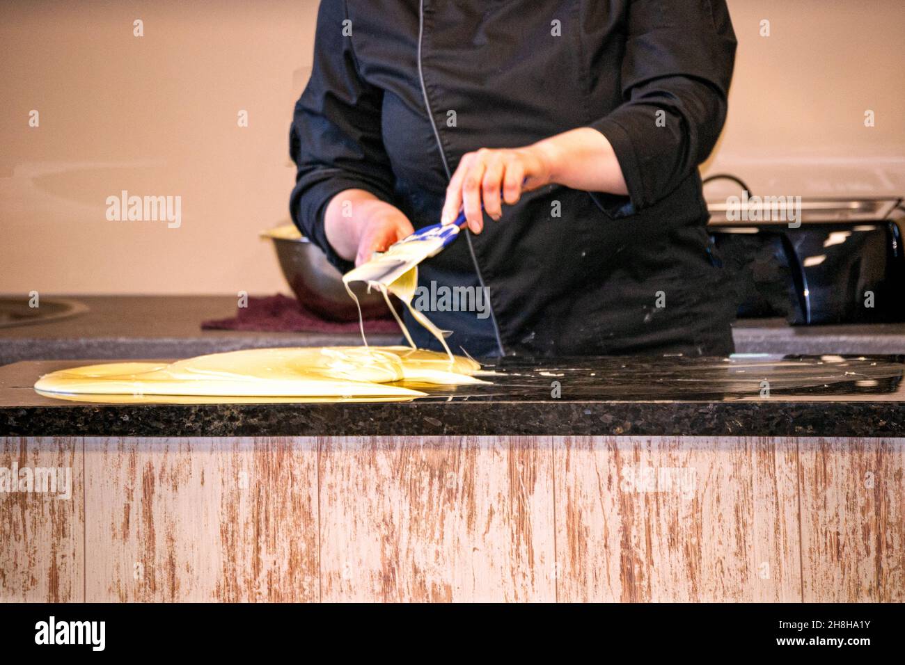 The process of making chocolate in a chocolate studio. Bitter chocolate ...