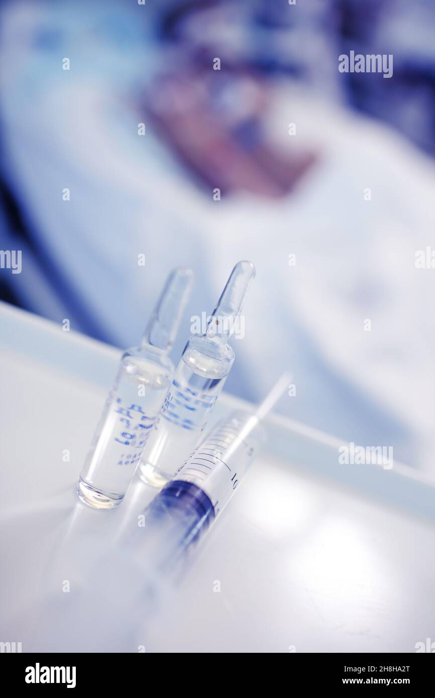 Drug vials and syringe at the patient bedside in the hospital Stock ...