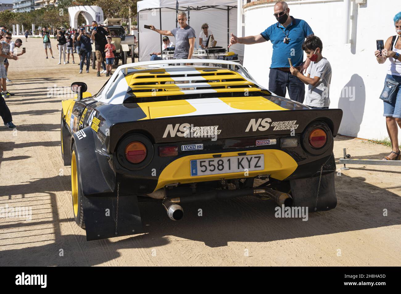 BARCELONA, SPAIN - Nov 03, 2021: A closeup of a black and yellow Lancia ...