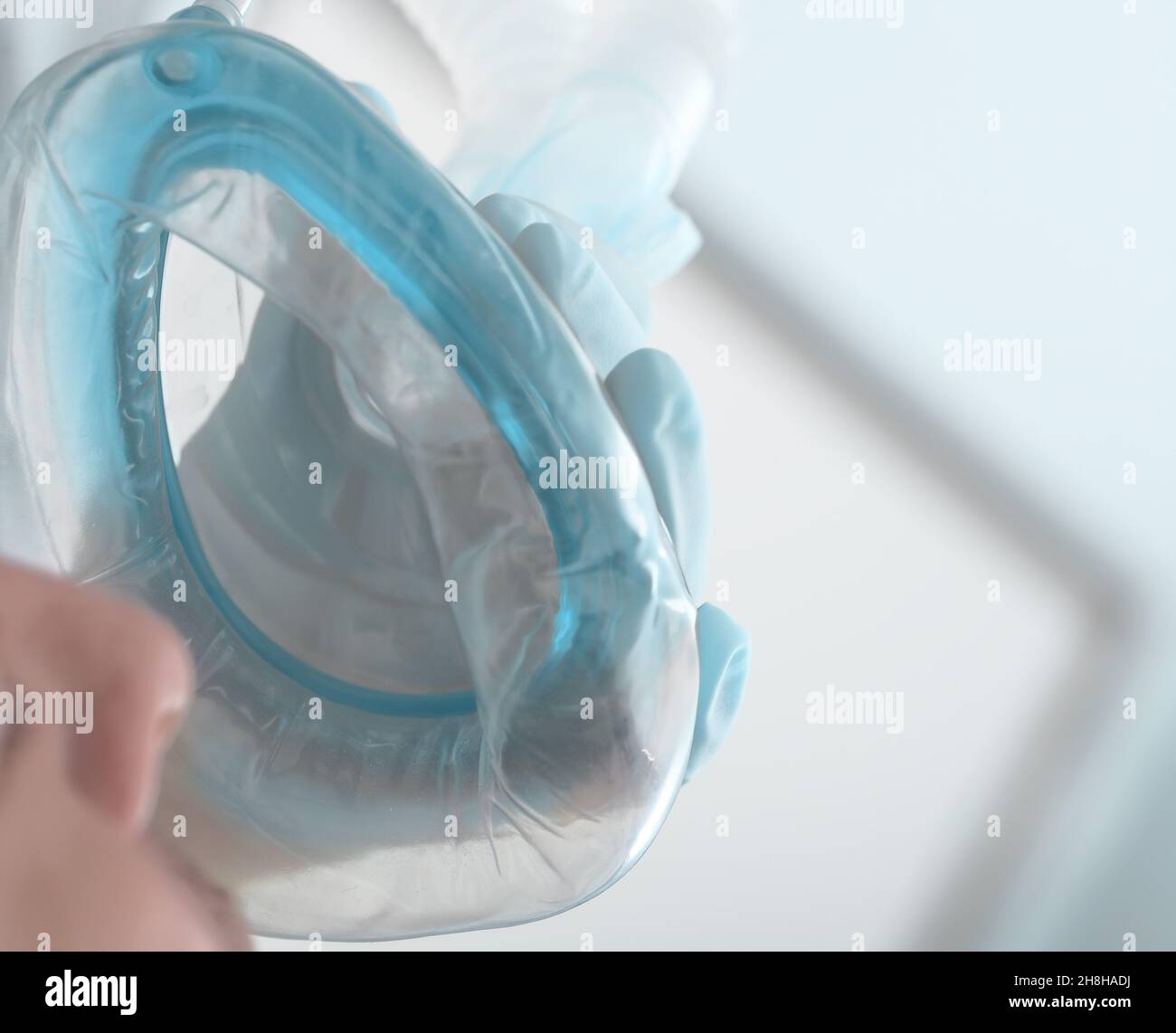 Doctor puts the oxygen mask on the patient before narcosis Stock Photo ...