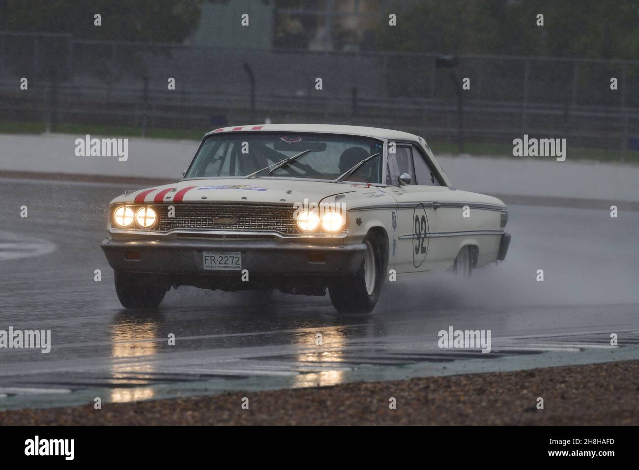 Racing through heavy rain, the licence plate says 'Water Wonderland ...