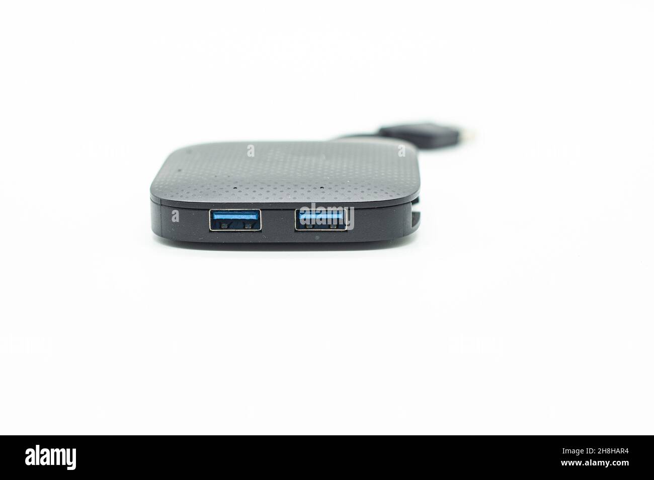 External USB hub and usb flash drives on white background Stock Photo ...