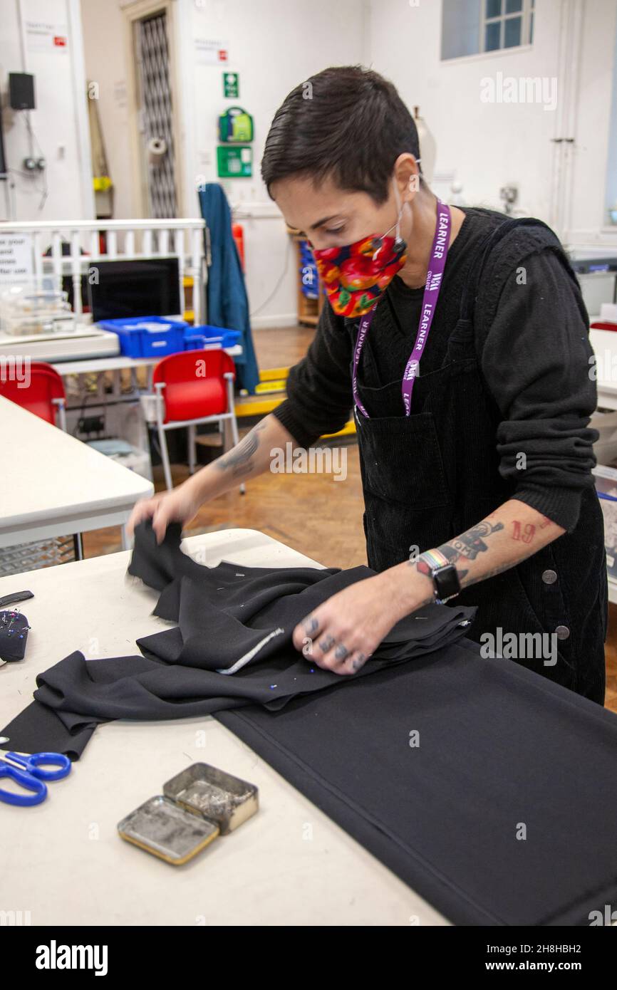 Woman Learning to Sew and Make Garments Stock Photo - Alamy
