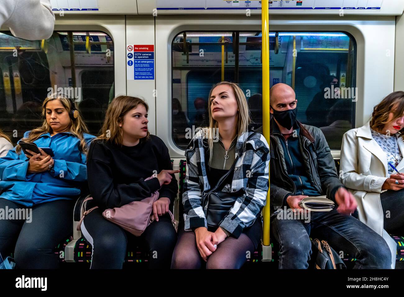A Group Of People Travelling On The London Underground, London, UK ...