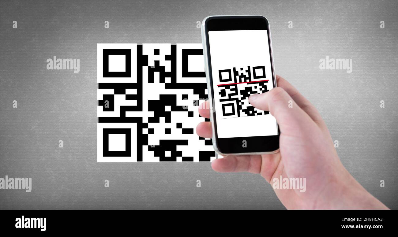 Cropped hand scanning qr code with smart phone with copy space on gray ...
