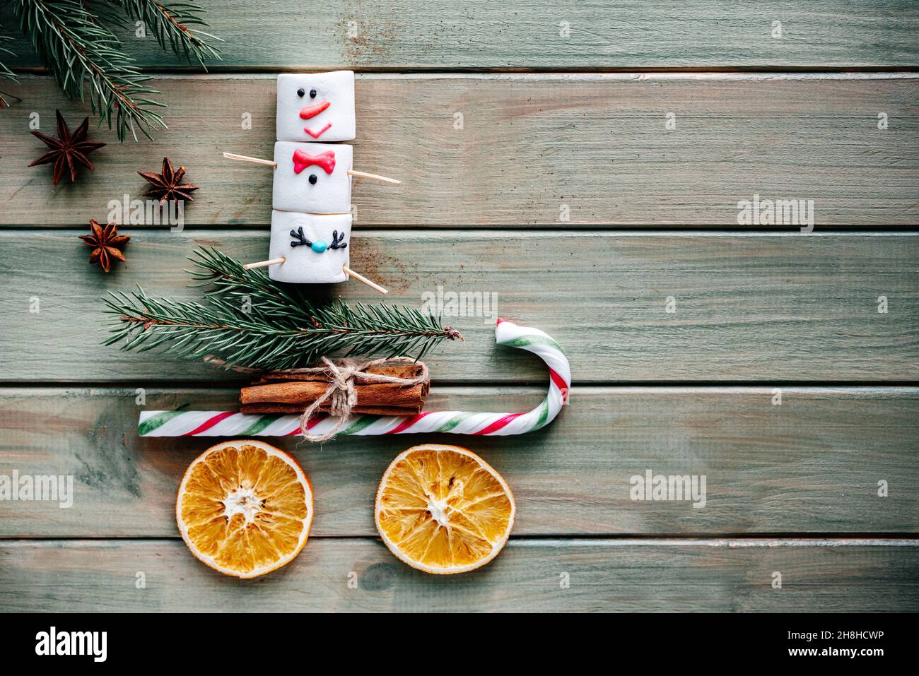 Christmas delivery background with snowman made of marshmallow riding ...