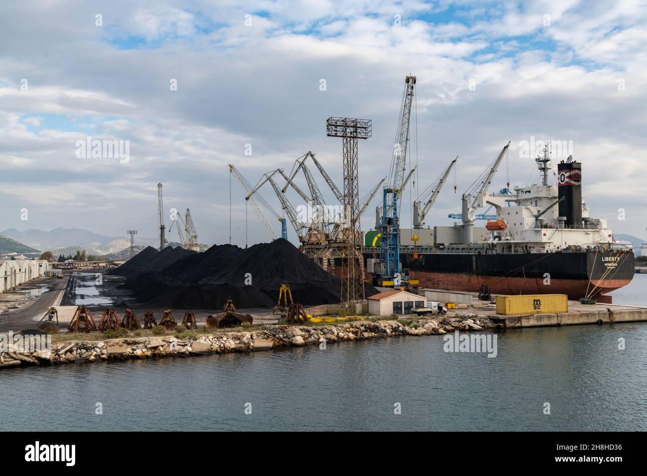 Ploce, Croatia - 18 November, 2021: harbor crane loading coal onto a ...