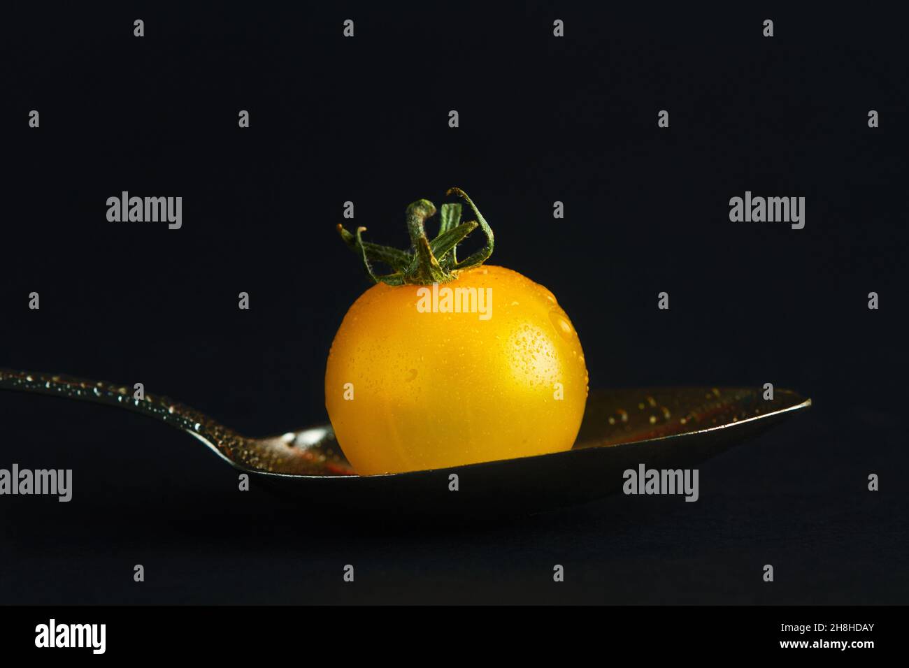 Wet yellow tomato hi-res stock photography and images - Alamy