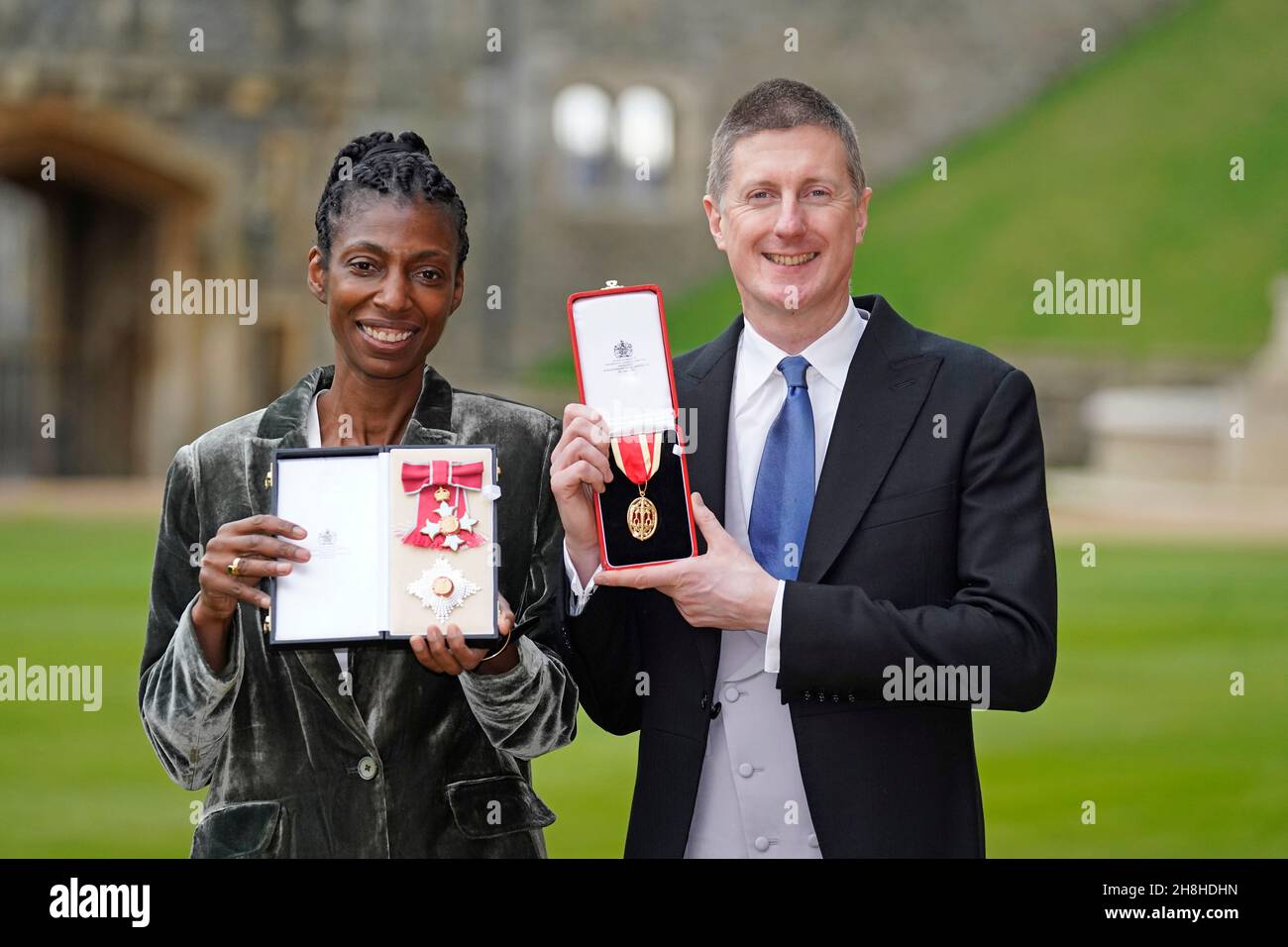 Dame Sharon White and her husband Sir Robert Chote with the awards they ...
