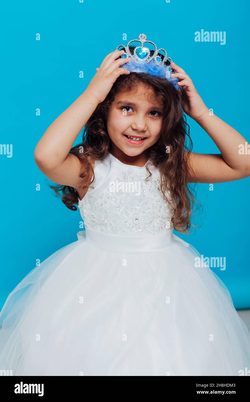 beautiful little girl in white dress as princess queen Stock Photo - Alamy