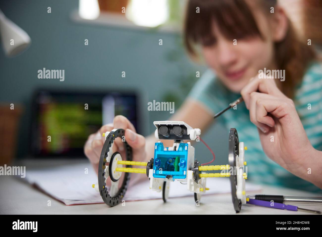 Teenage Girl Building Solar Powerd Robot In Bedroom At Home Stock Photo ...