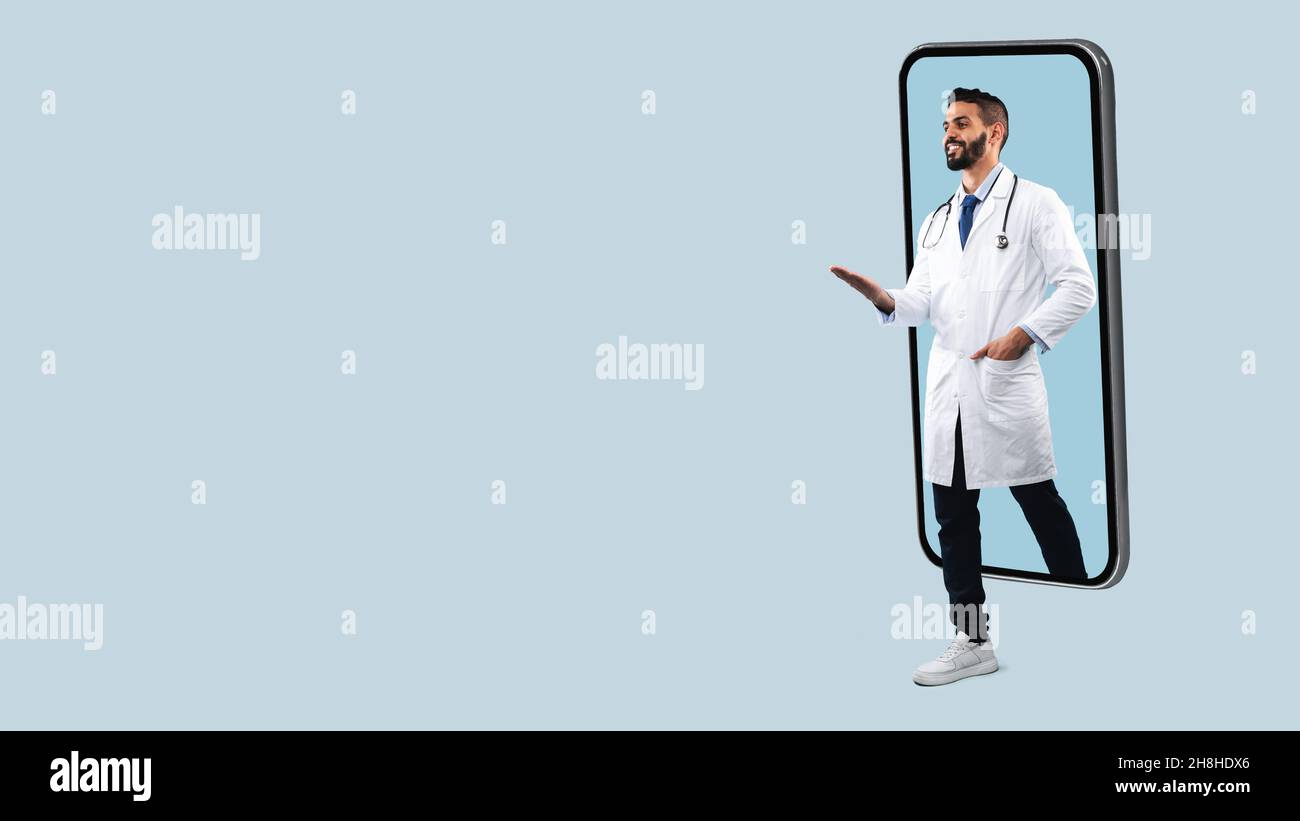 Doctor coming out big smartphone screen, panorama Stock Photo - Alamy
