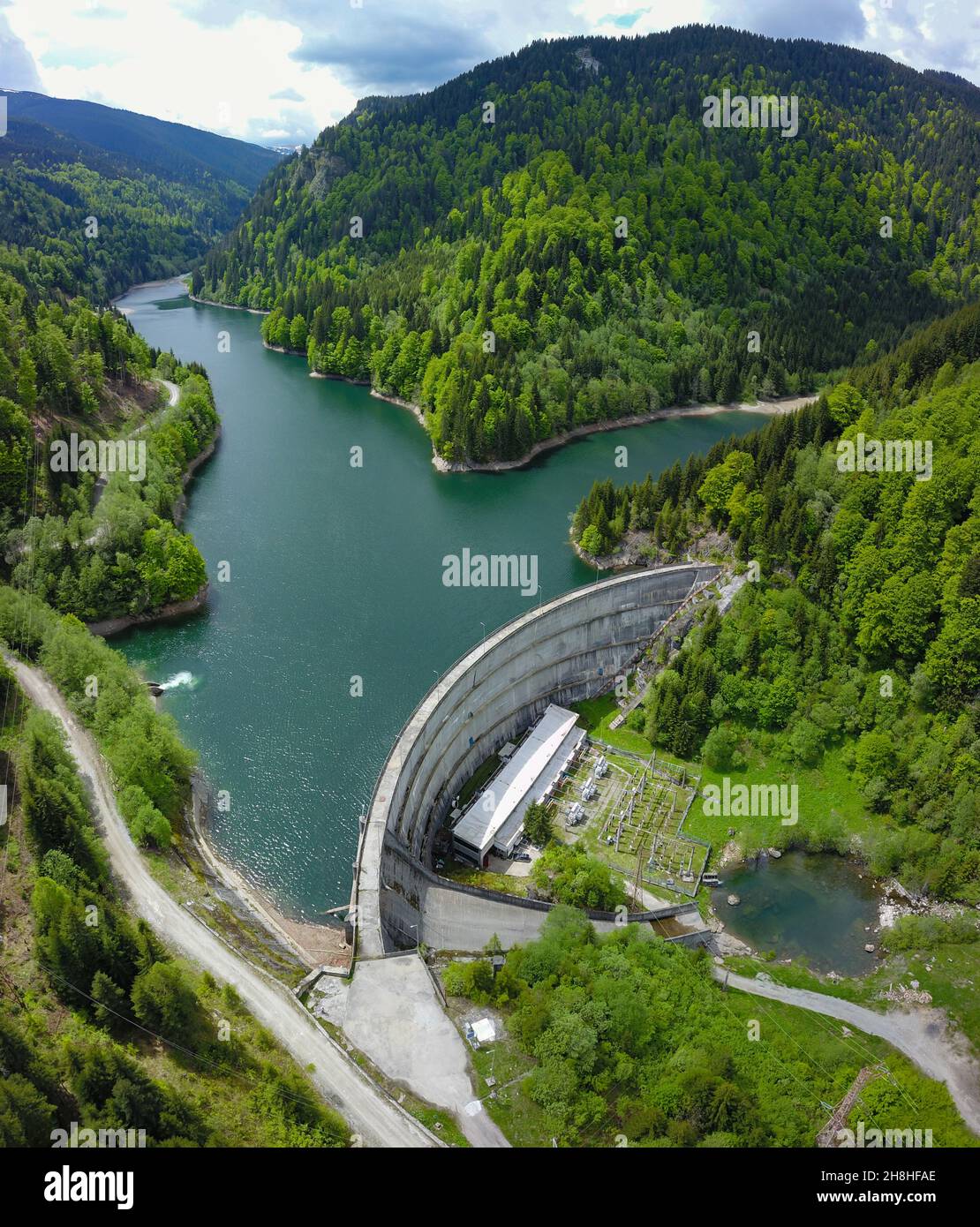 Aerial drone view above Petrimanu hydroelectric Lake and its dam ...
