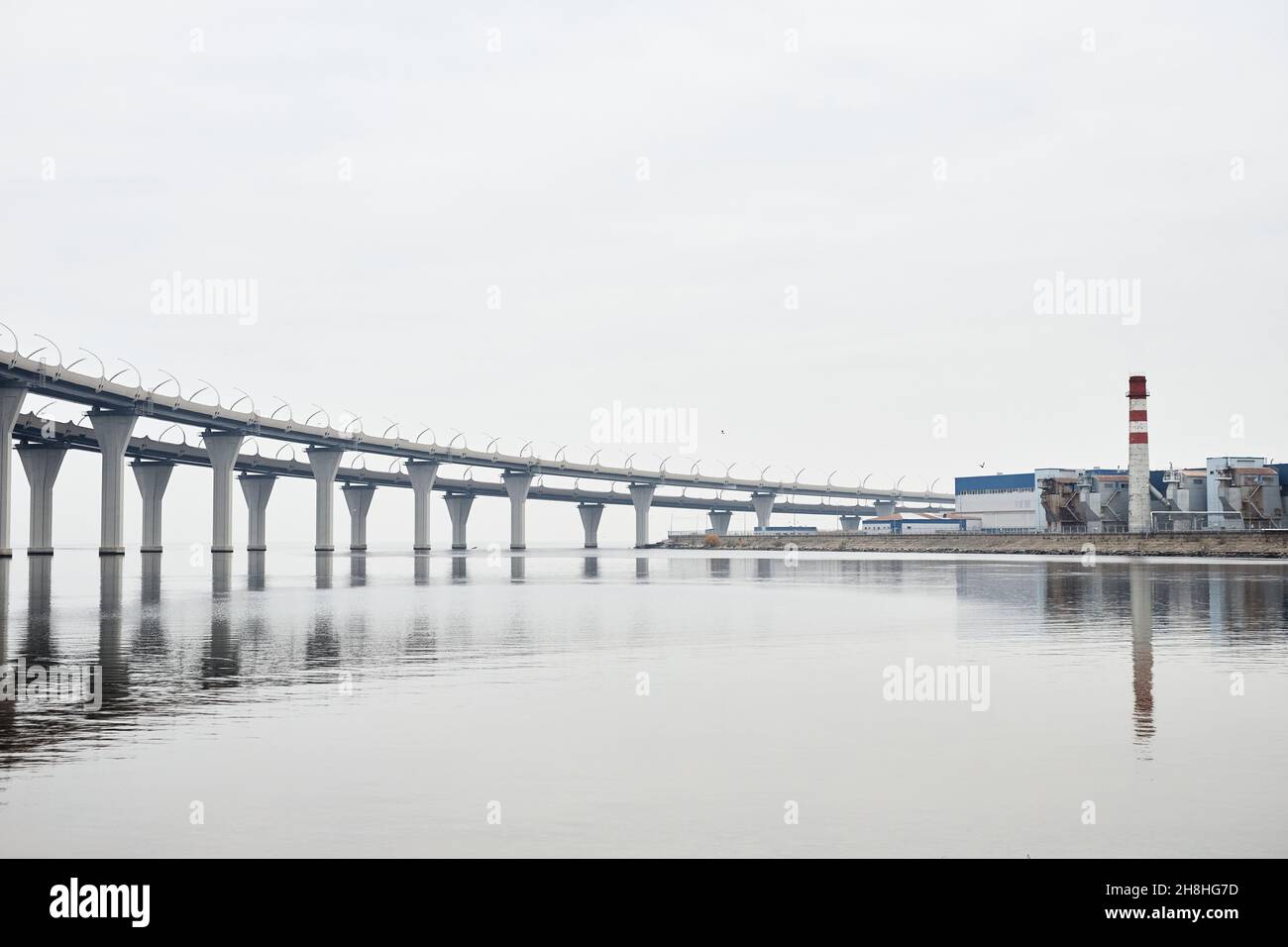 Wide angle background image of industrial production area with bridge ...