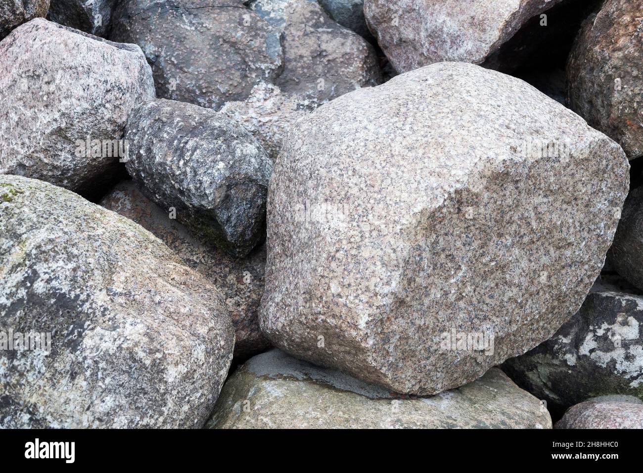 Rockfall on the road in the mountains. Stones of different sizes ...