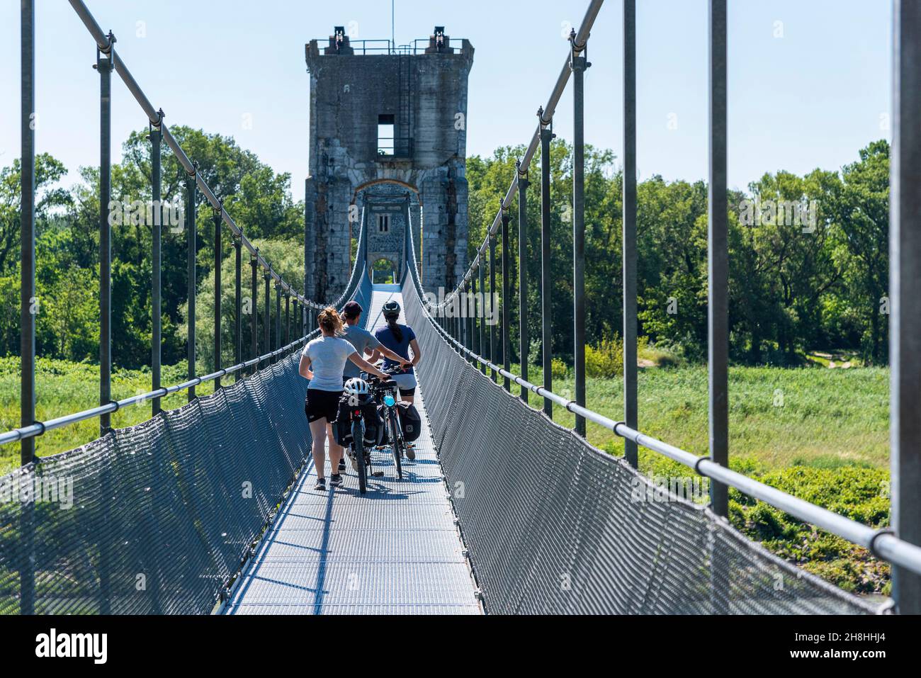 France, Ardeche, ViaRhôna, Rochemaure, cyclists crossing the Rochemaure ...