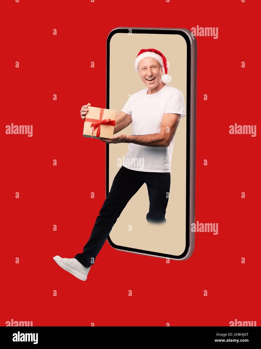 Mature Man Giving Christmas Present Coming Out Cell Screen Stock Photo ...