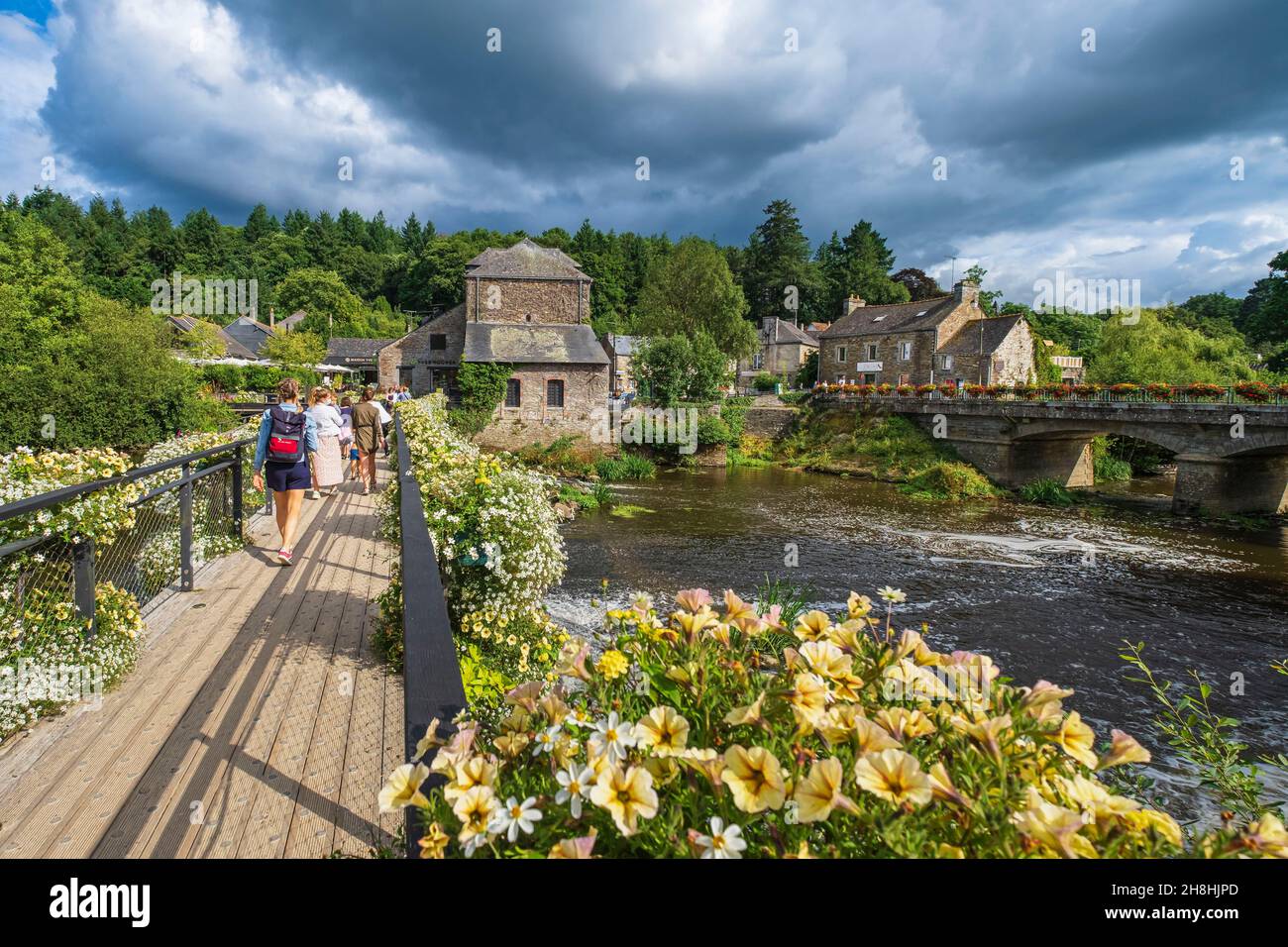 France, Morbihan, La Gacilly, footbridge over the Aff river and Yves ...