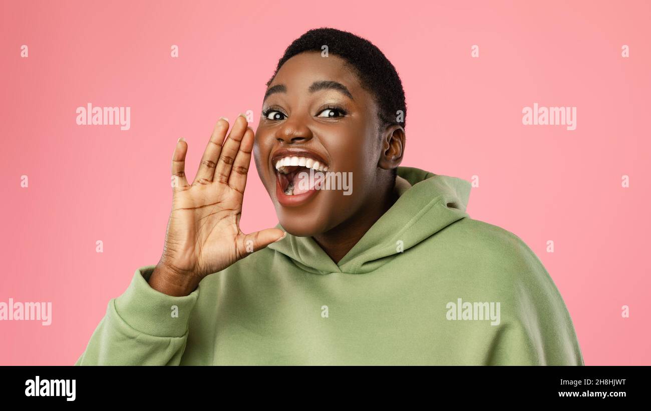 Joyful African Lady Shouting Holding Hand Near Mouth, Pink Background ...