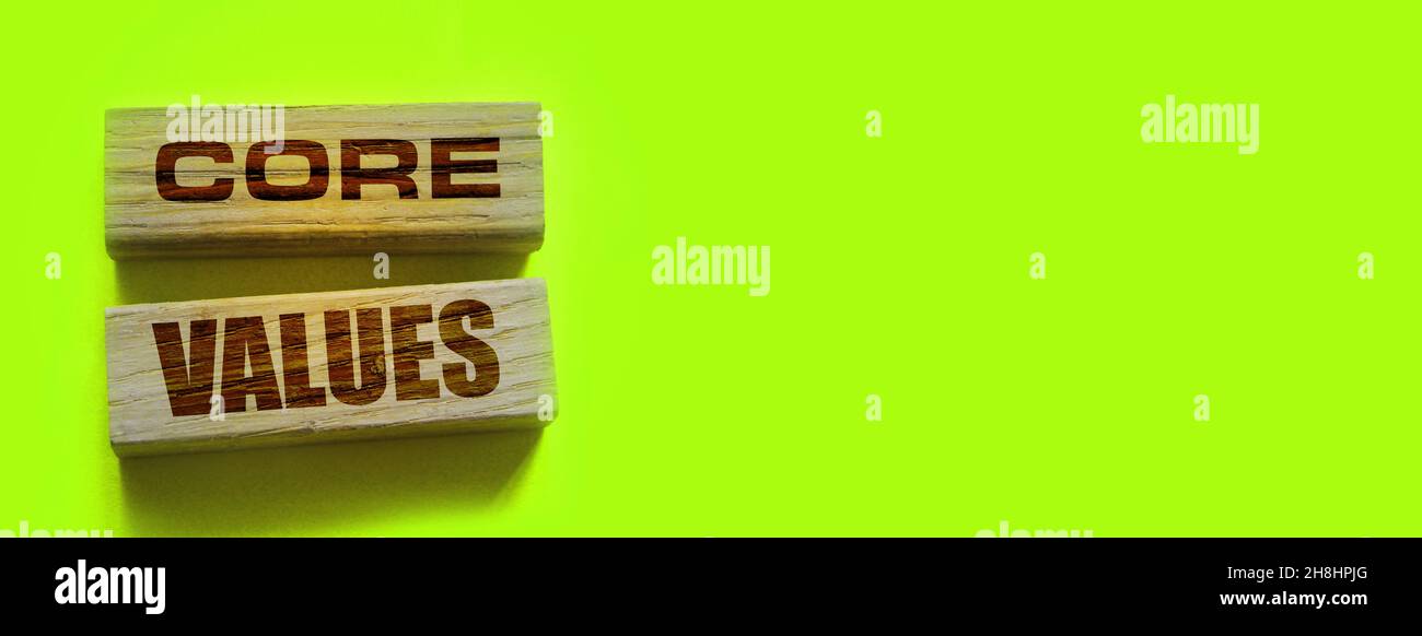 core values words on wooden blocks on yellow background. Business ...
