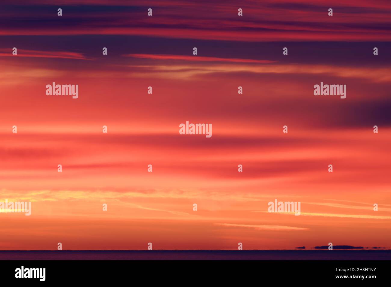 Sunrise looking east from Mumbles head, over the sea to distant horizon ...
