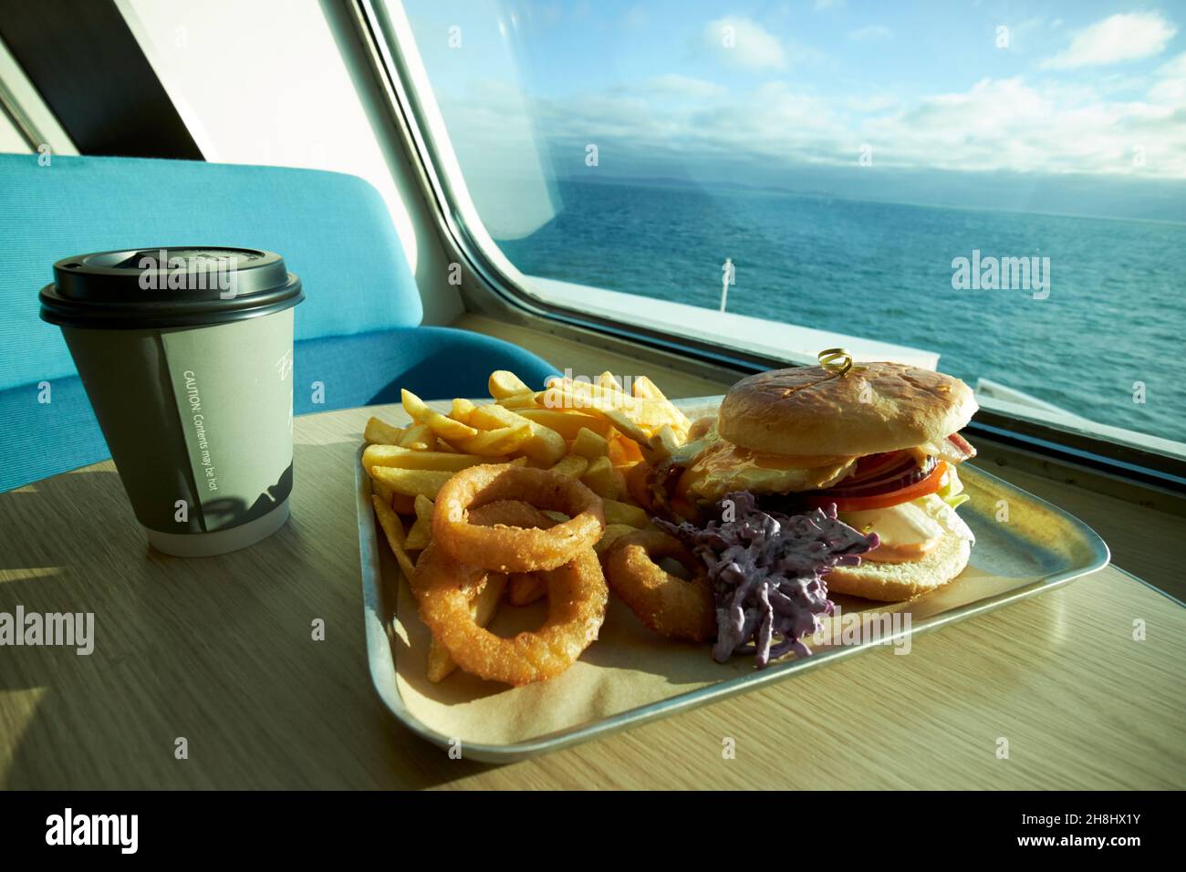 chicken burger onion rings coleslaw and fries meal on a ferry crossing ...