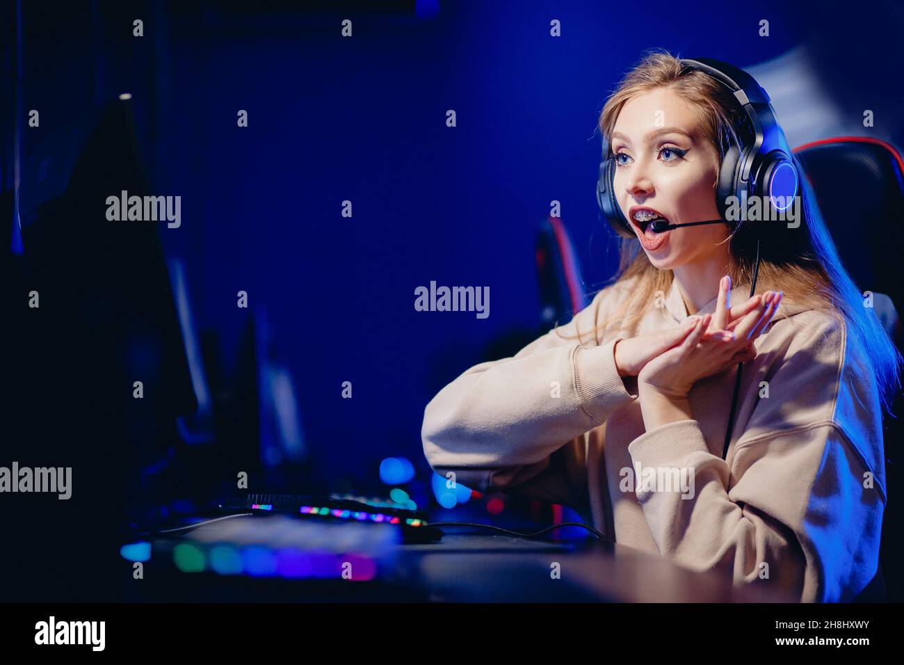 woman streamer play on online video game tournament, neon color Stock ...