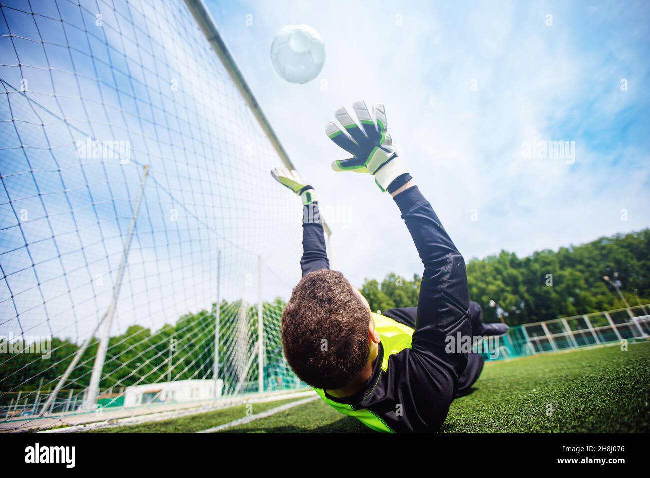 Goalkeeper soccer man didnt catch ball after penalty Stock Photo - Alamy
