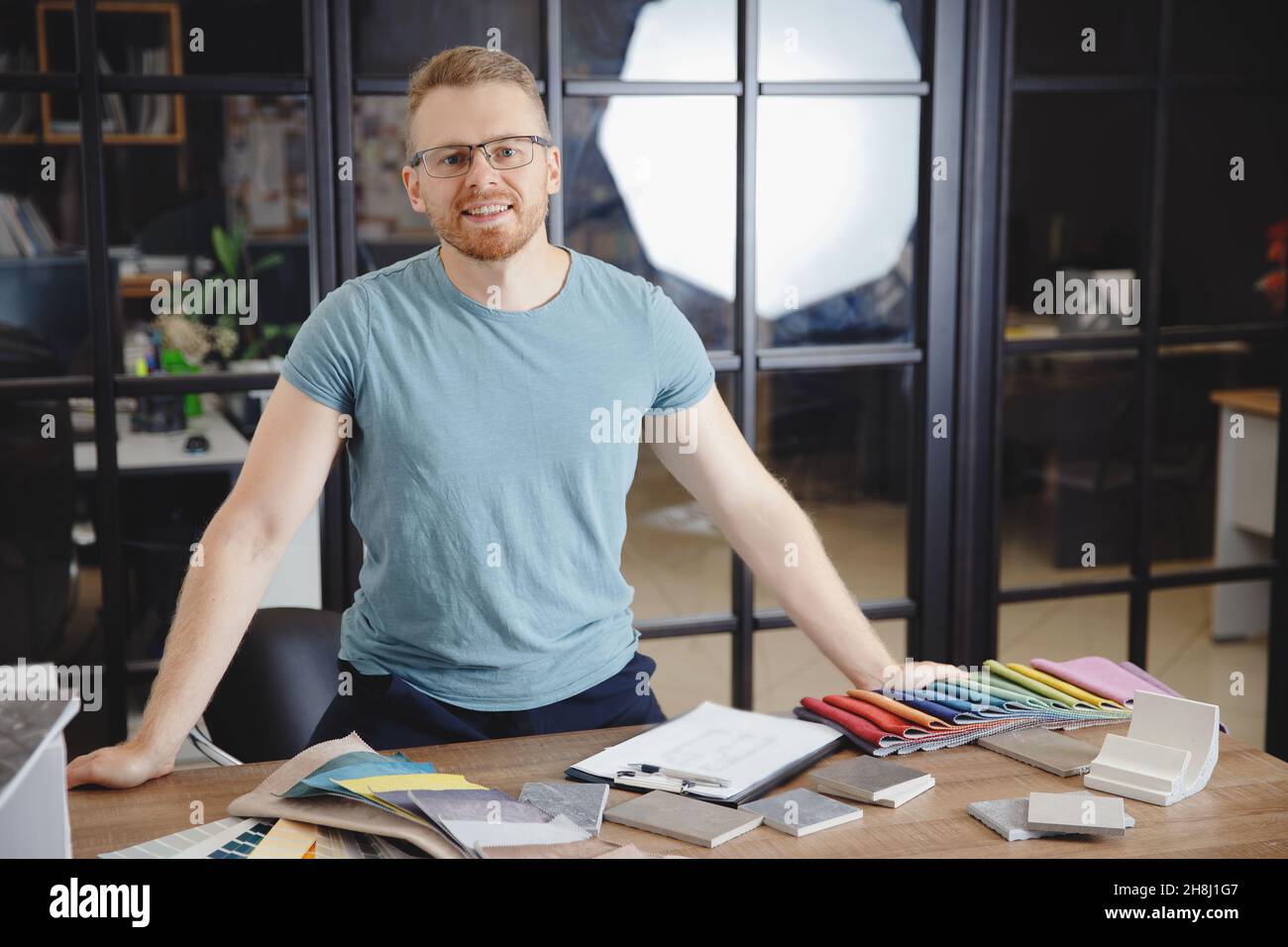 Architectural supervision of design project, male designer at workplace ...