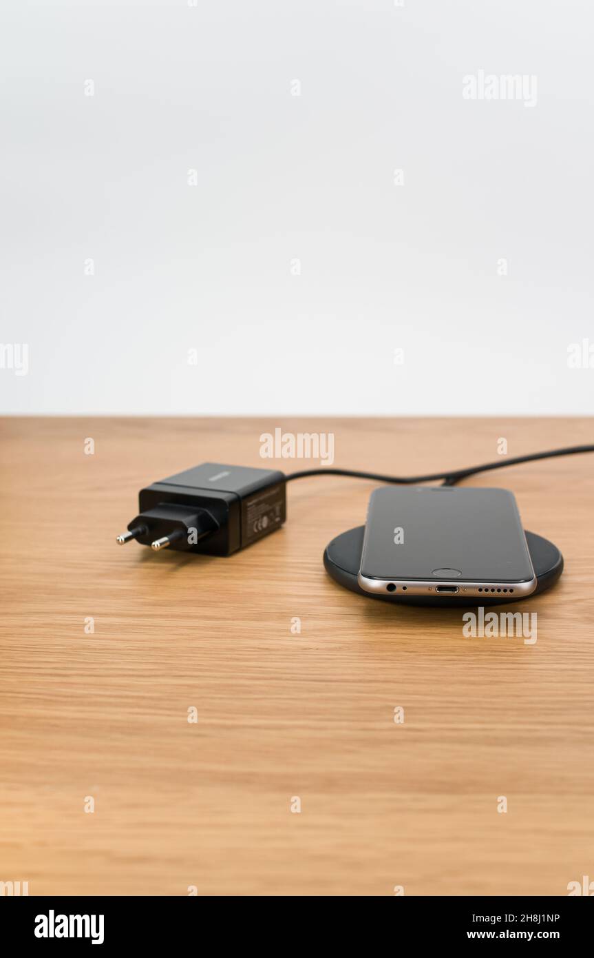 INVERIGO, ITALY - Nov 29, 2021: wireless induction device charger with ...