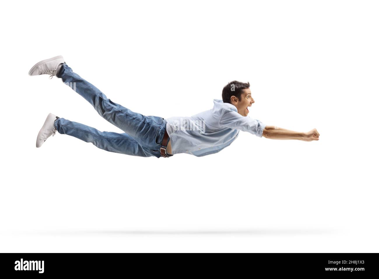 Full length profile shot of a casual young man in a jeans and shirt ...