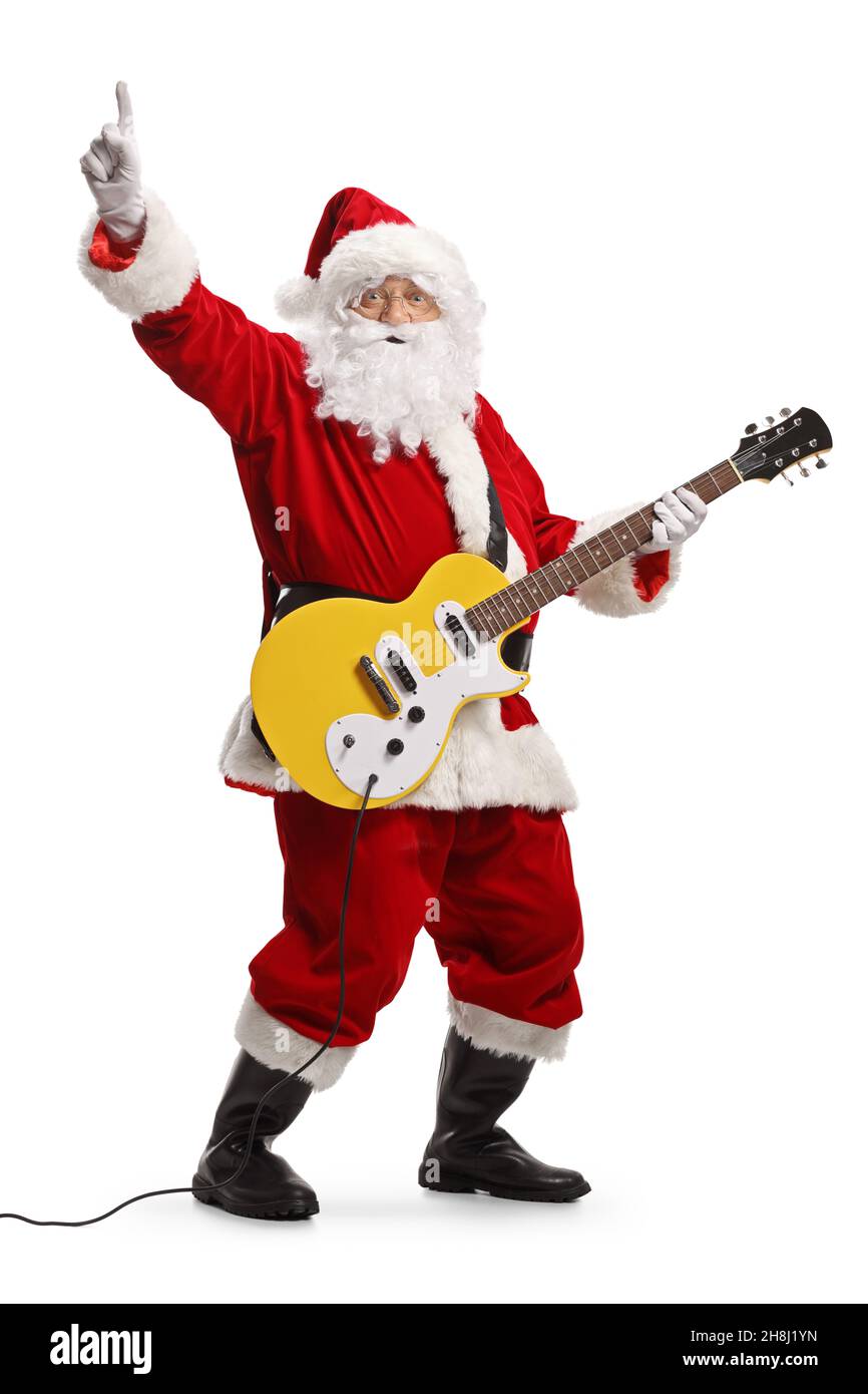 Santa claus playing an electirc guitar and pointing up isolated on ...