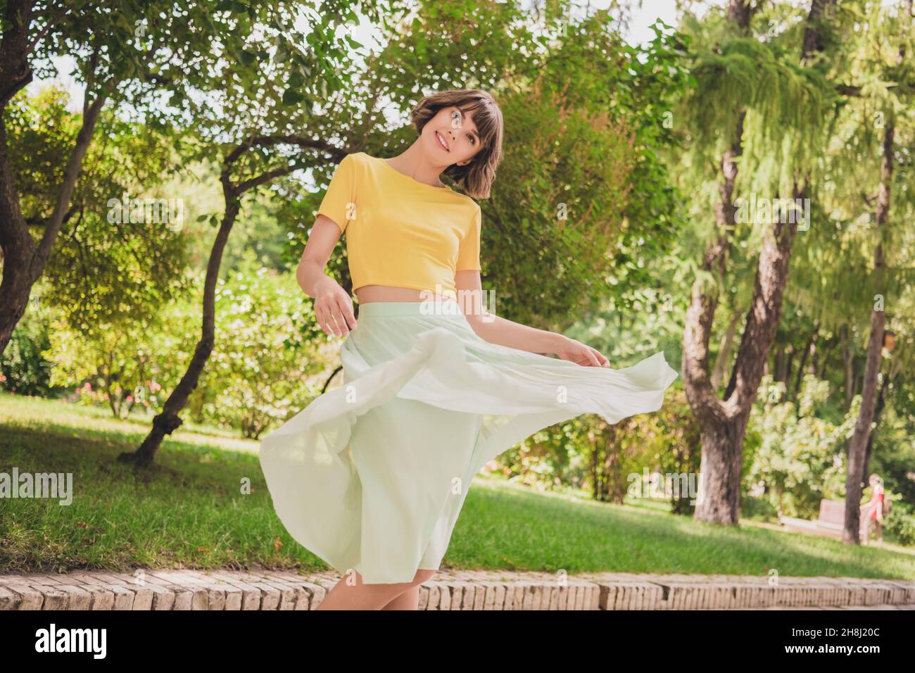 Wind blowing skirt hi-res stock photography and images - Alamy