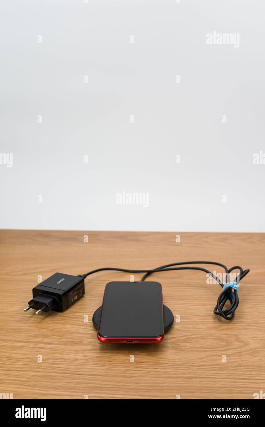 INVERIGO, ITALY - Nov 29, 2021: wireless induction device charger with ...