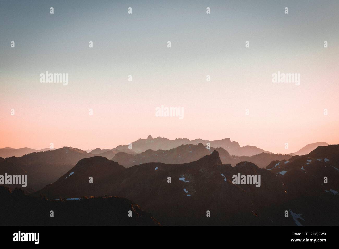 A beautiful sunset over mountains in North Cascades Stock Photo - Alamy