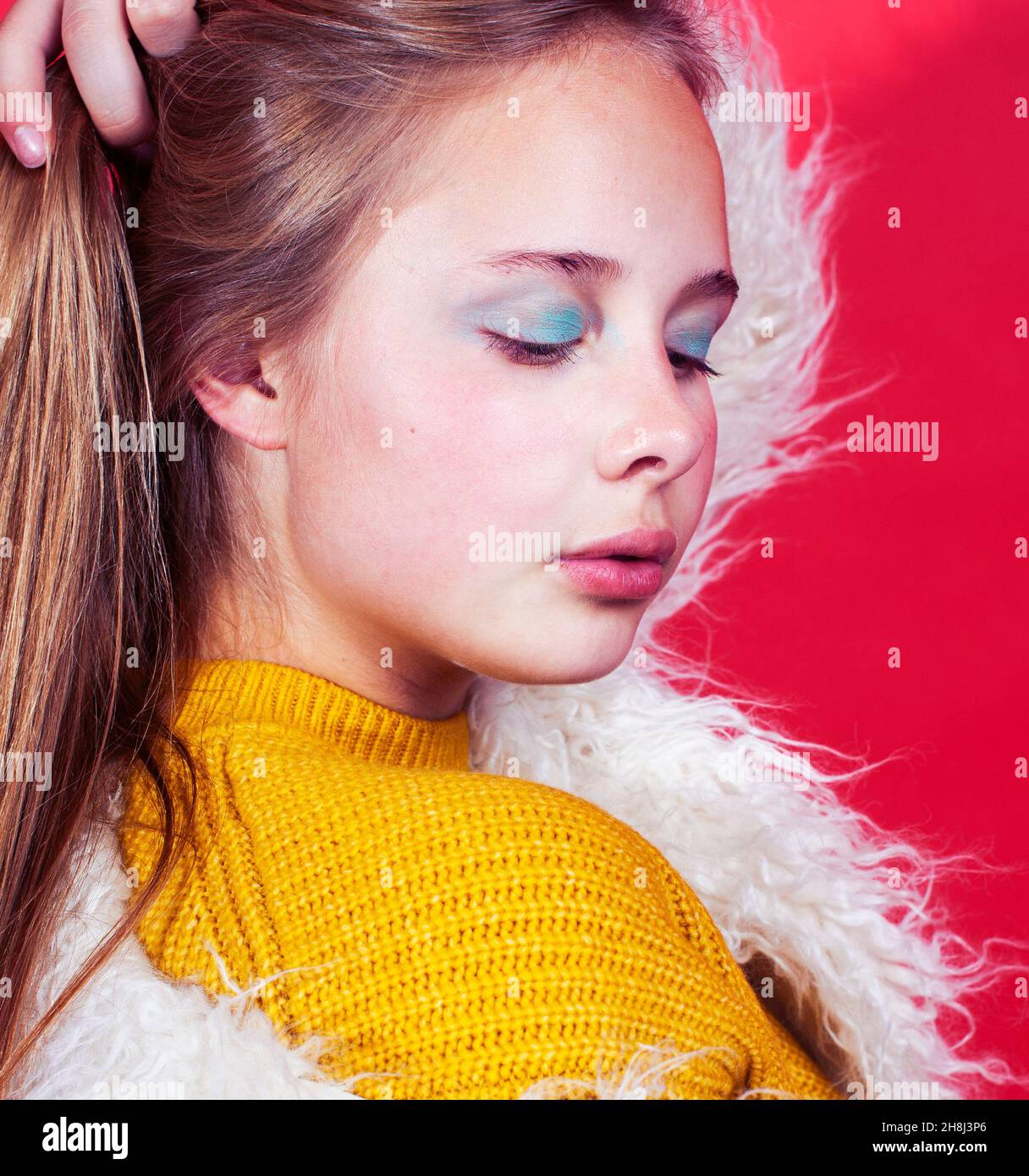 young pretty emitonal posing teenage girl on bright red background ...