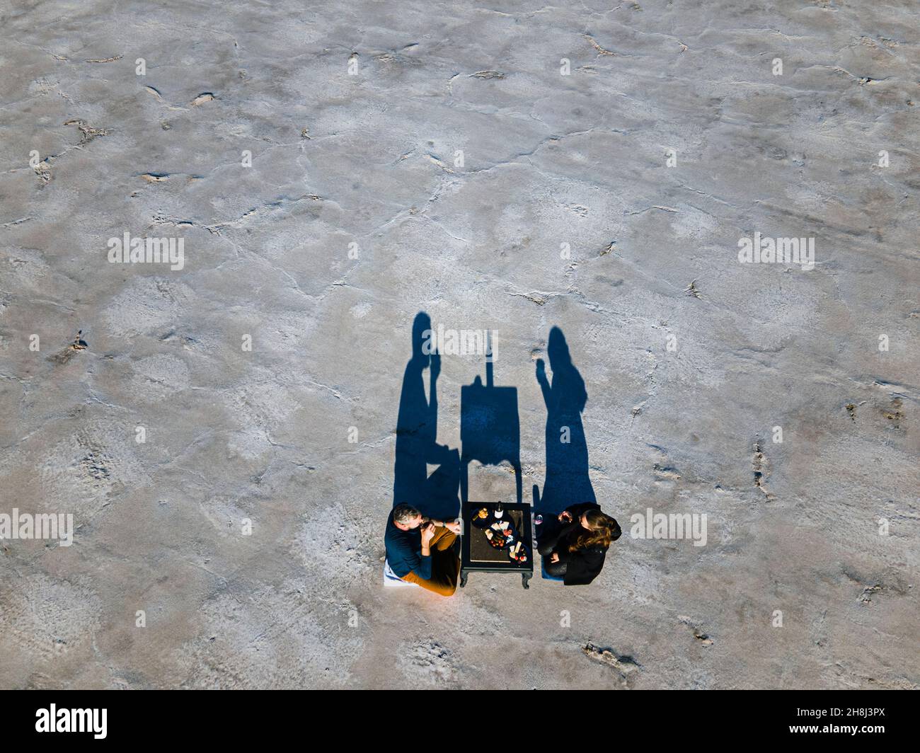 Birds eye view of two people having a picnic in the desert Stock Photo ...