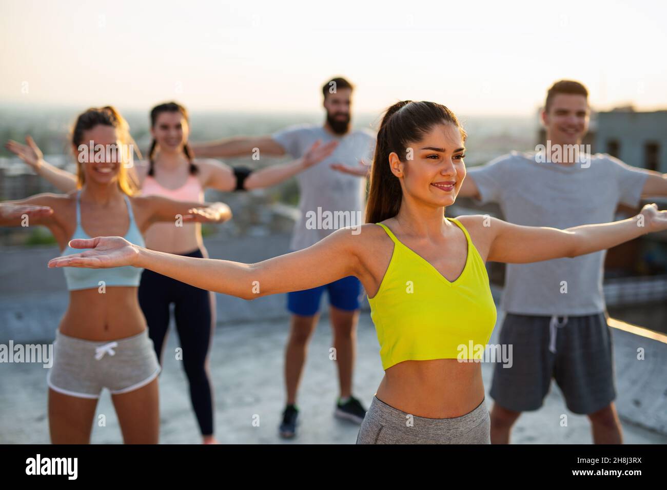 Group of fit healthy friend, people exercising together outdoor Stock ...