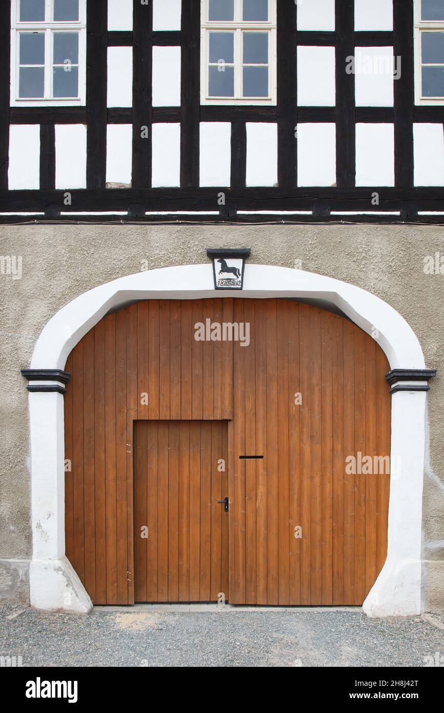 Facade of a half-timbered house with a door and a window Stock Photo ...