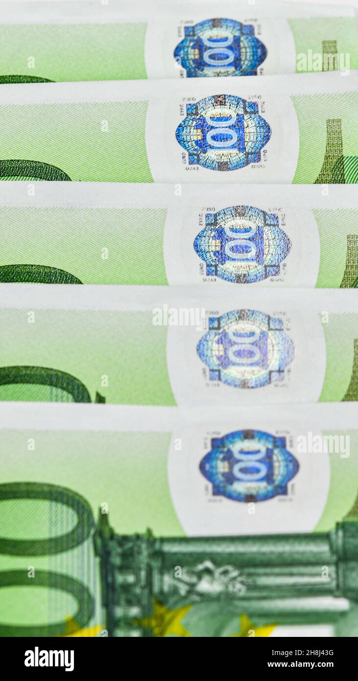 Vertical shot of a 100 euro banknote detail isolated on white ...