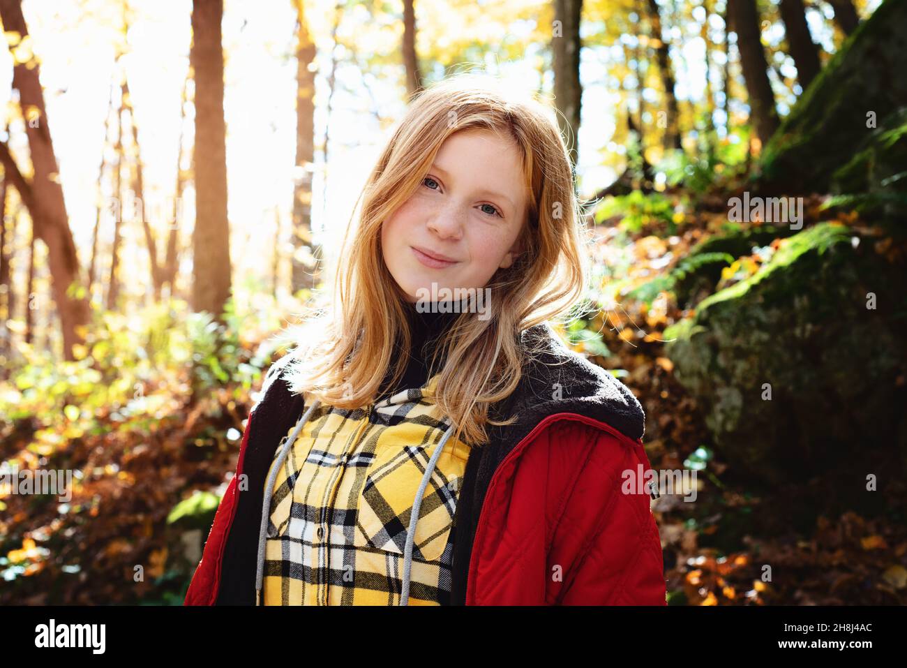 Red Haired Tween Girl Hiking in the Fall woods Stock Photo - Alamy